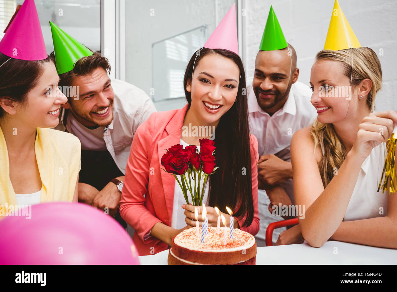 Casual business team celebrating a birthday Stock Photo - Alamy