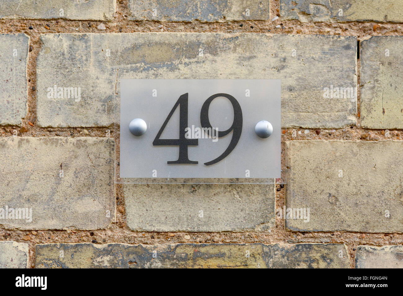 House number 49 sign on wall Stock Photo - Alamy
