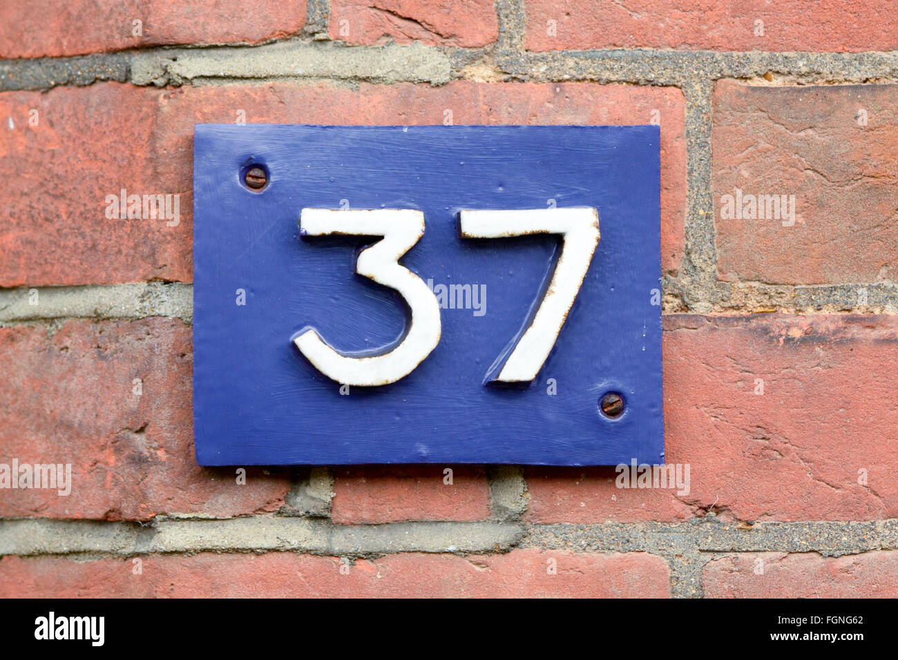 House number 37 sign on wall Stock Photo - Alamy