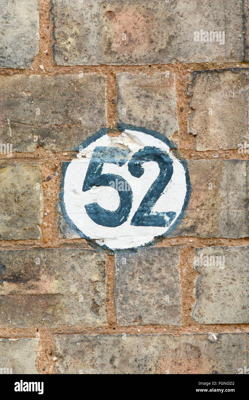 House number 52 painted sign on wall Stock Photo - Alamy