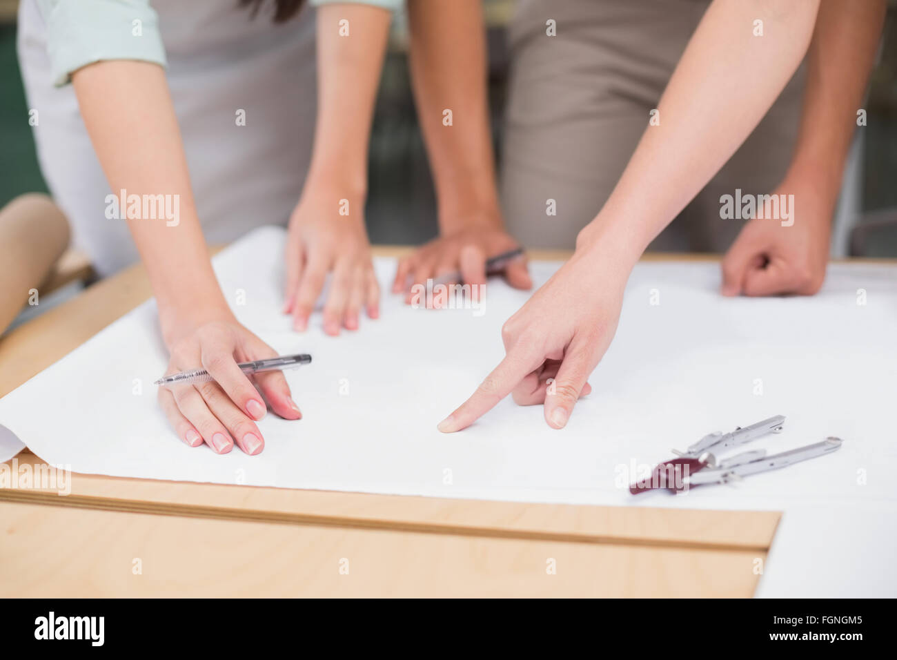 Architecture team working together at desk Stock Photo - Alamy