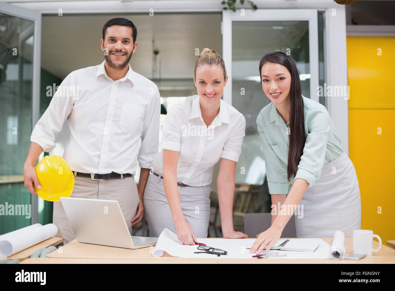 Architecture team working together at desk Stock Photo - Alamy