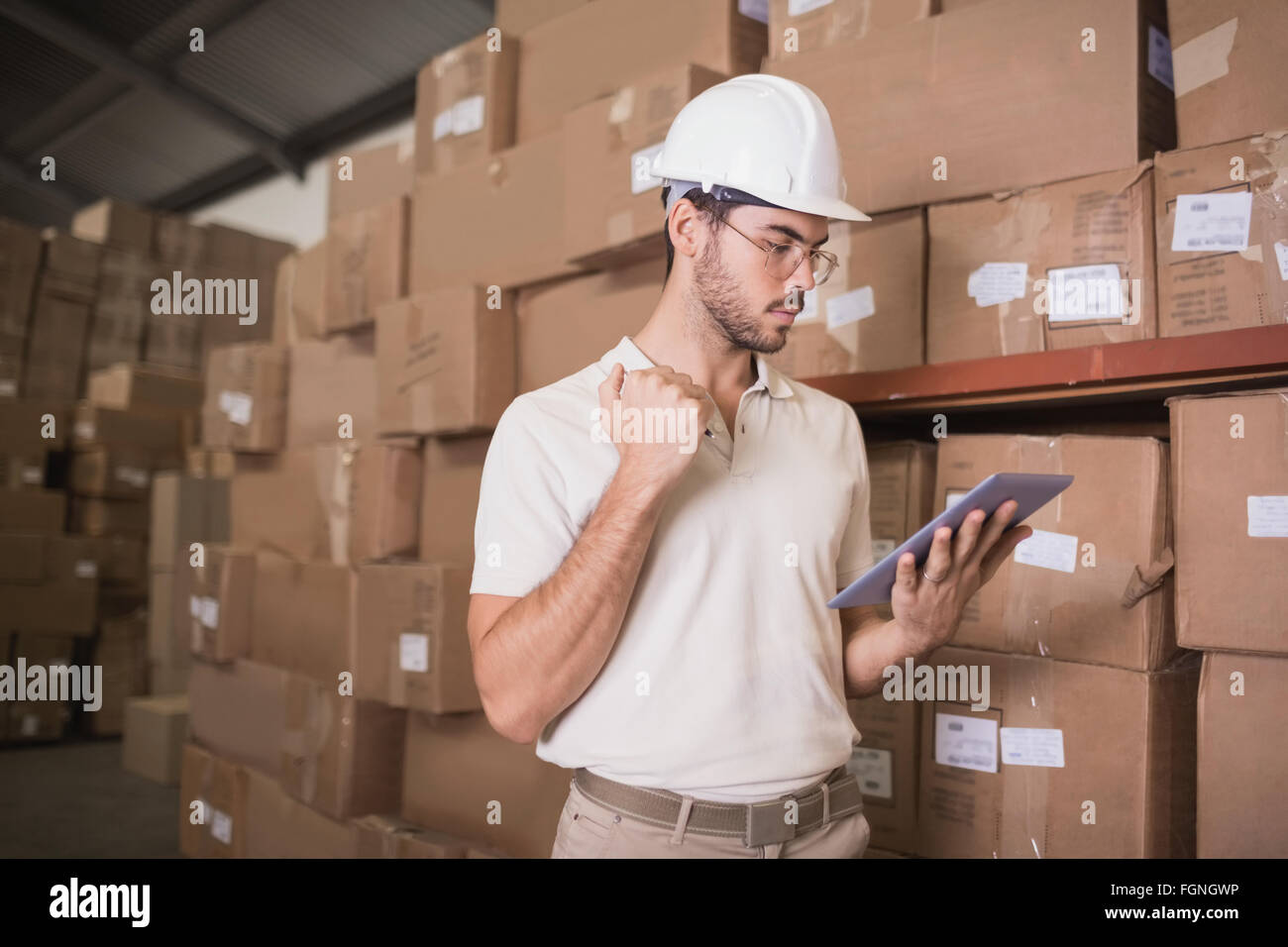 Young worker tablet storehouse hi-res stock photography and images - Alamy