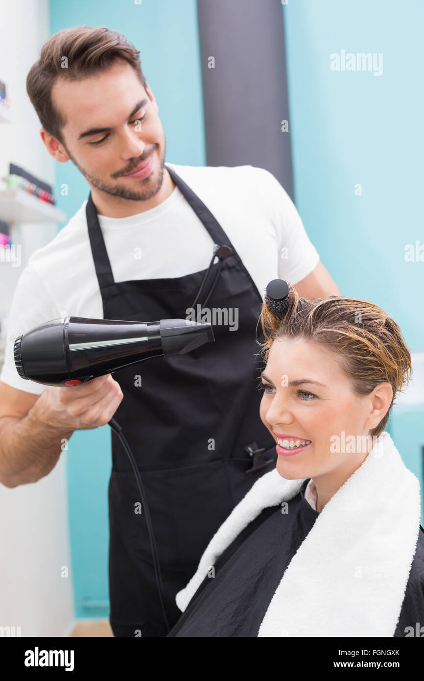 Woman getting her hair dried Stock Photo - Alamy