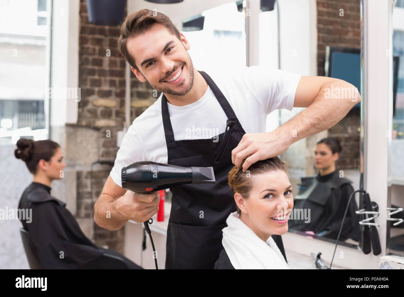Woman getting her hair dried Stock Photo - Alamy