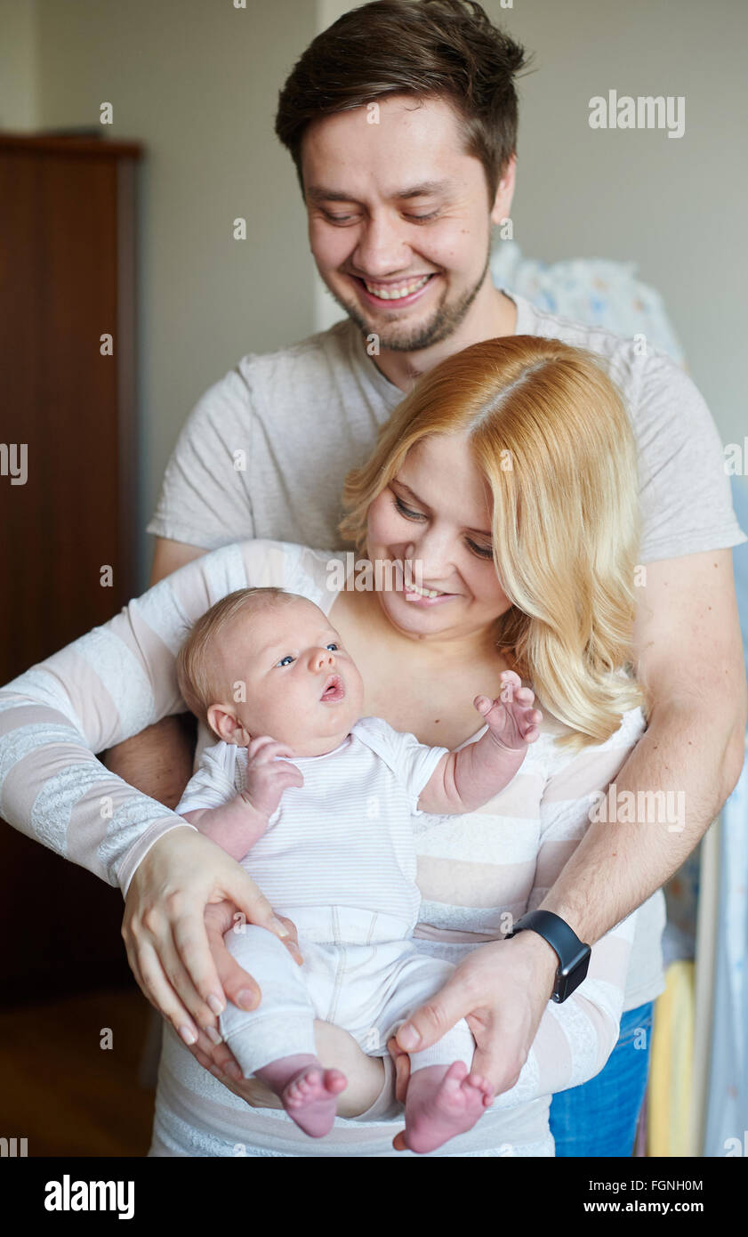 Happy Young Attractive Family parents with Newborn Baby Stock Photo - Alamy