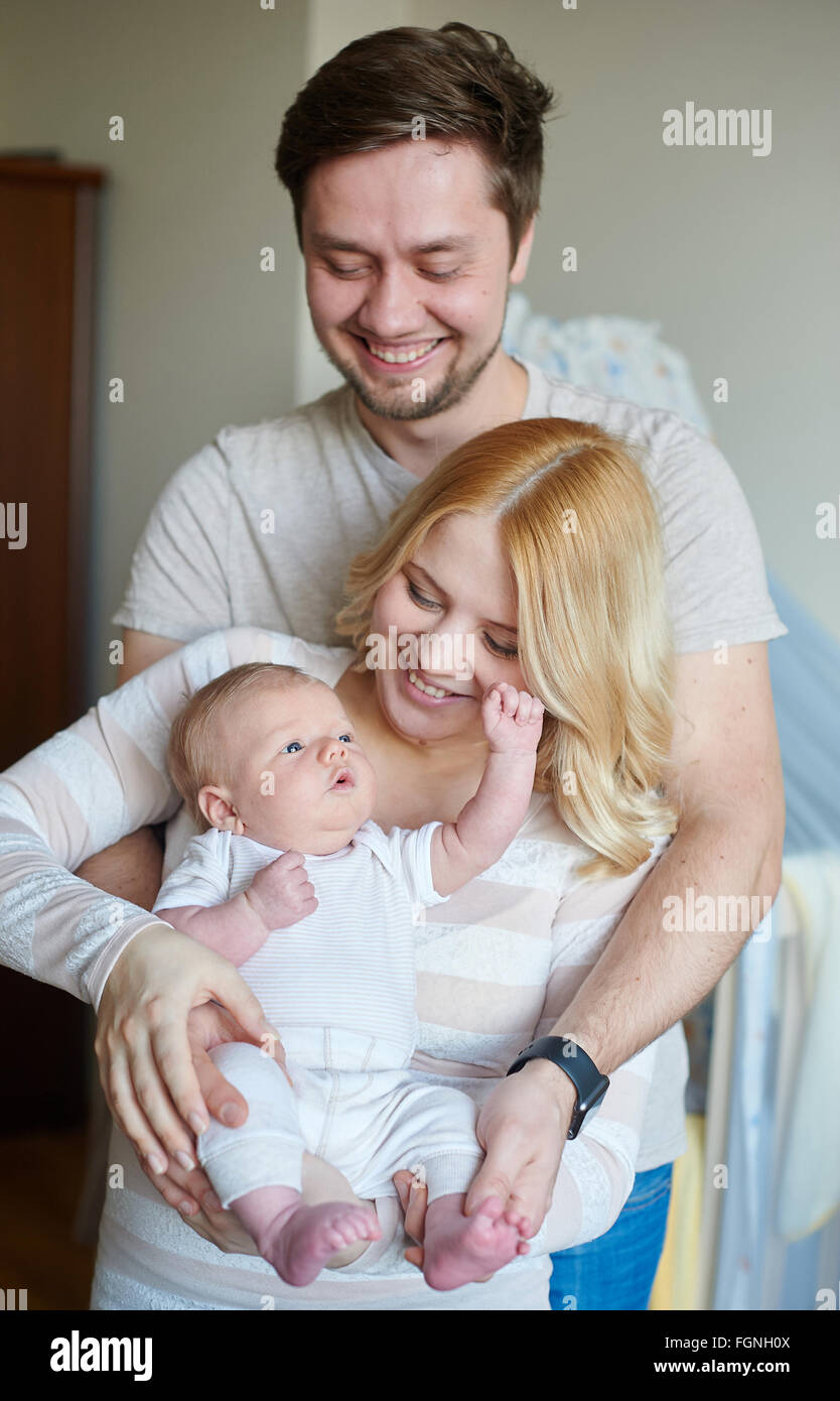 Happy Young Attractive Family parents with Newborn Baby Stock Photo - Alamy
