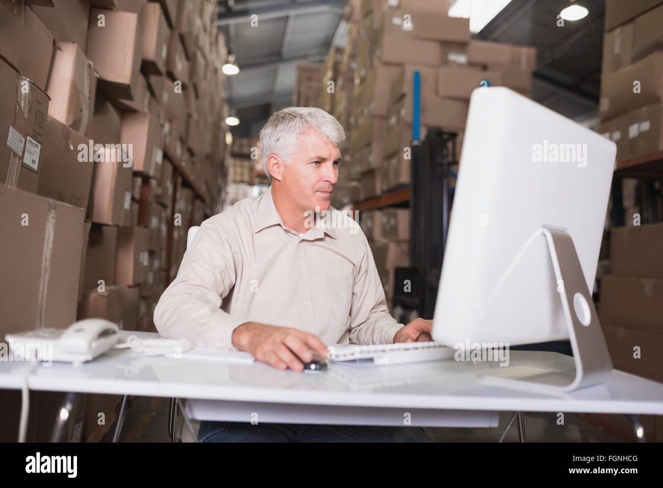 Warehouse manager using computer Stock Photo - Alamy