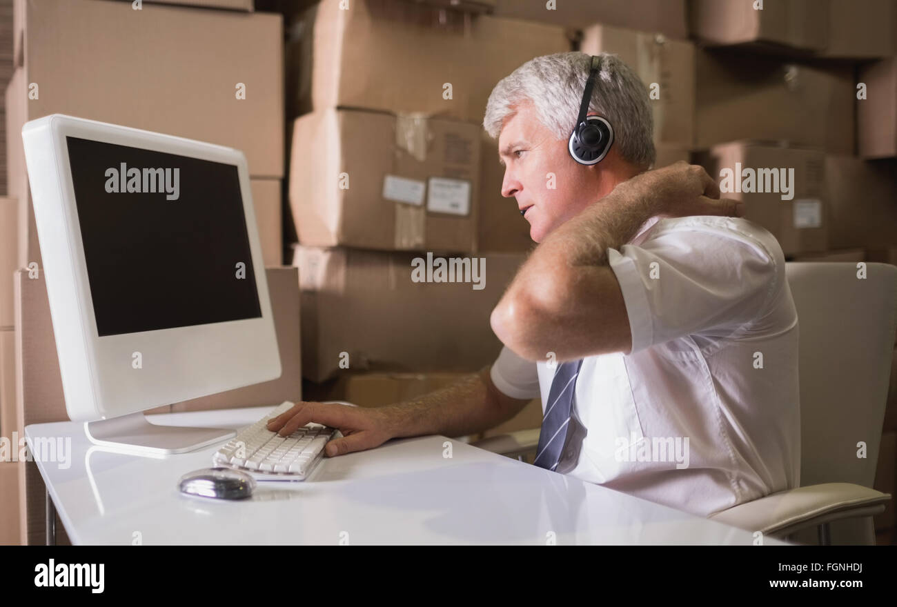 Warehouse manager using computer Stock Photo - Alamy