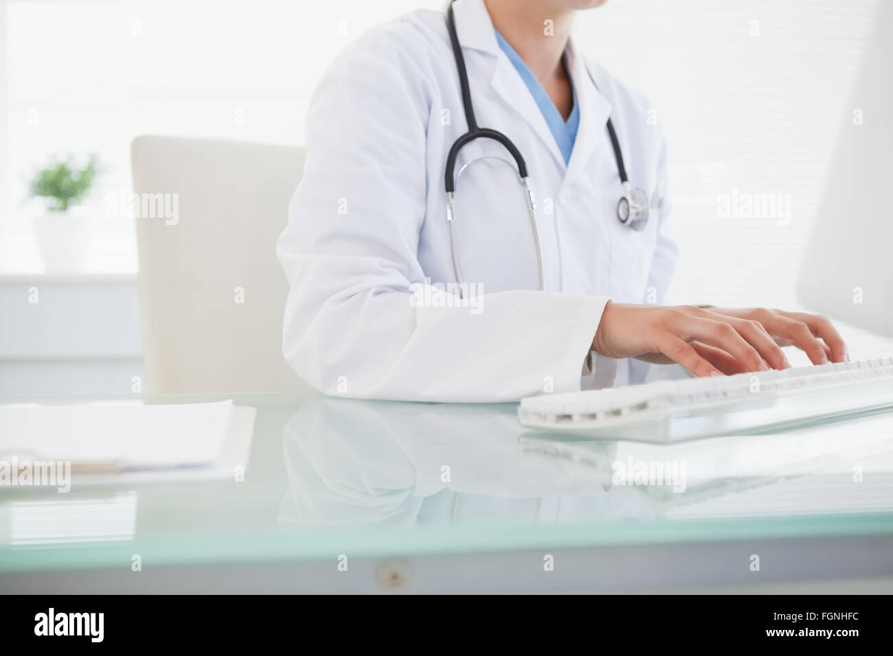 Doctor typing notes hi-res stock photography and images - Alamy