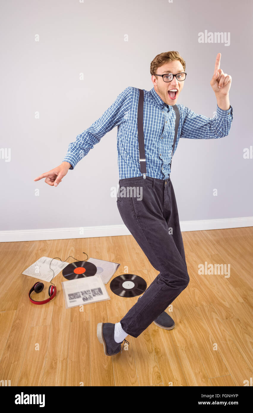 Geeky hipster dancing to vinyl Stock Photo - Alamy