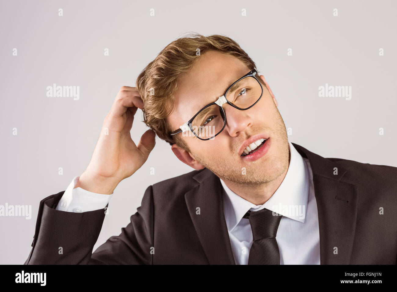 Man suit scratching head hi-res stock photography and images - Alamy