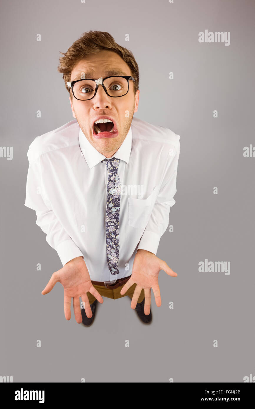 Geeky businessman gesturing to camera Stock Photo - Alamy