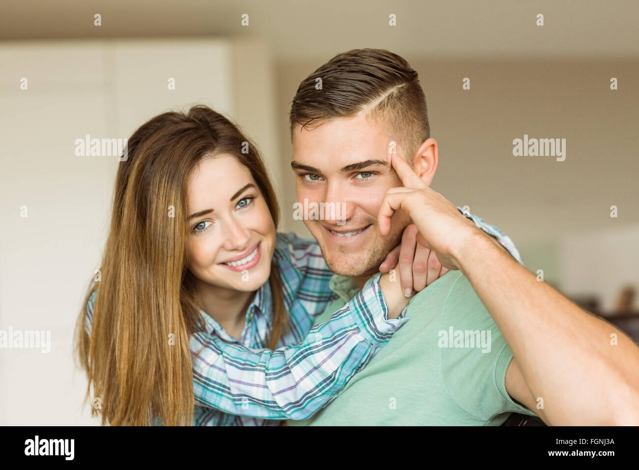 Cute couple relaxing on couch Stock Photo - Alamy