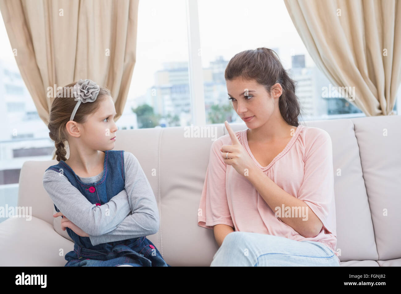 Mother scolding her naughty daughter Stock Photo - Alamy