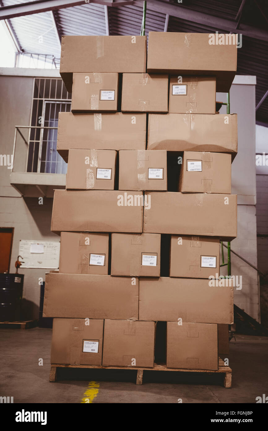 Cardboard boxes in warehouse Stock Photo - Alamy