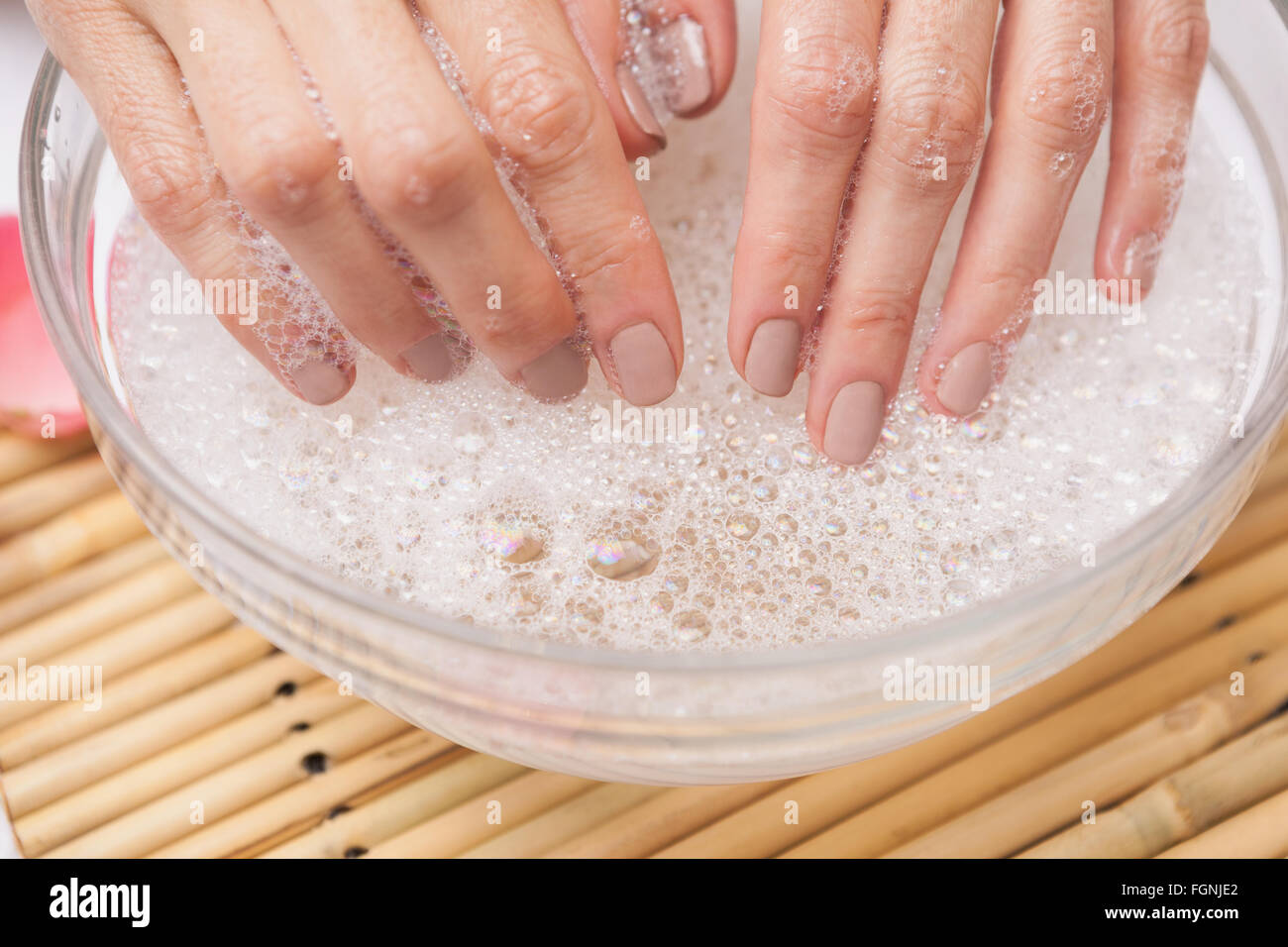Customer washing their nails Stock Photo - Alamy