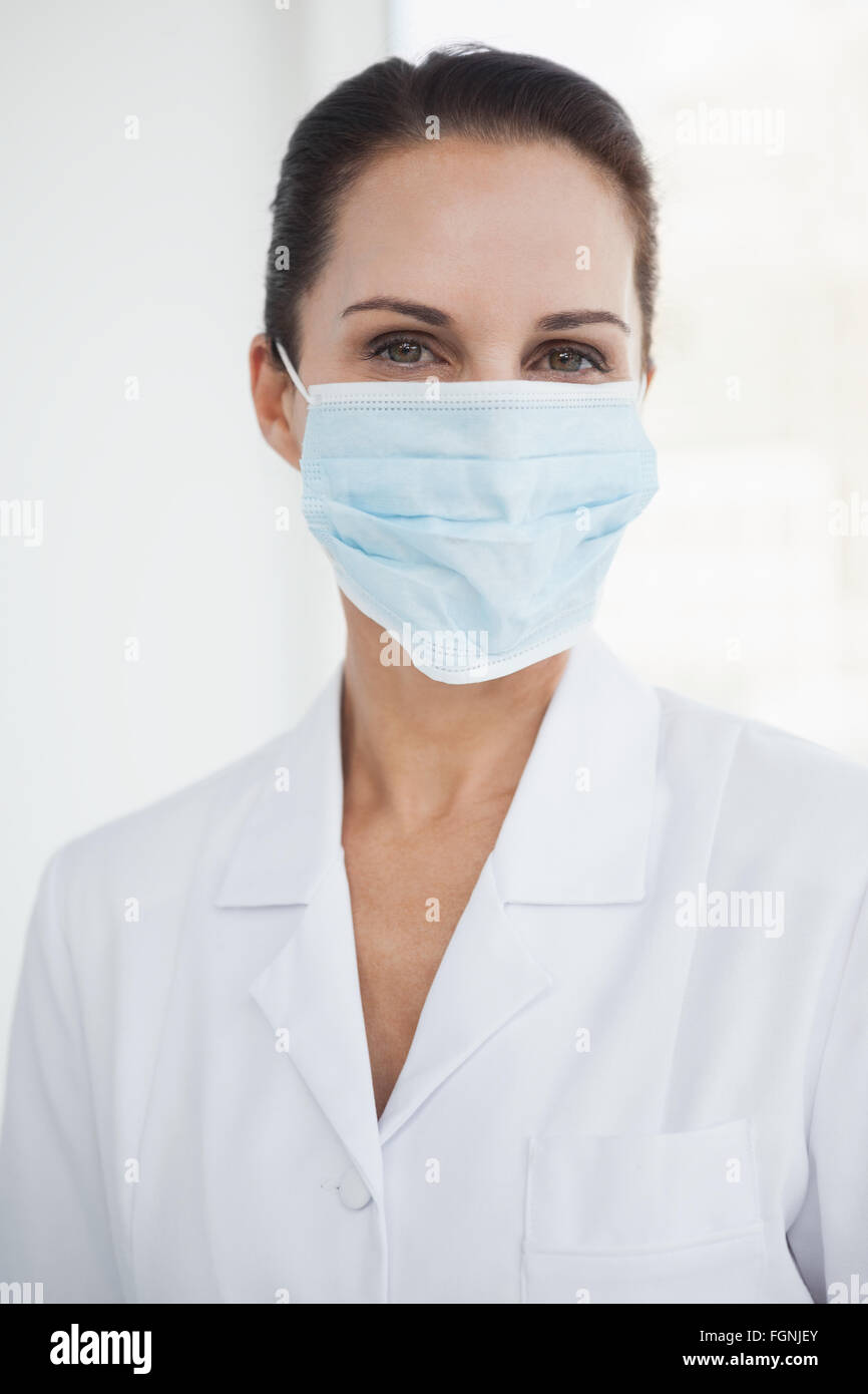 Doctor wearing a surgical mask Stock Photo - Alamy