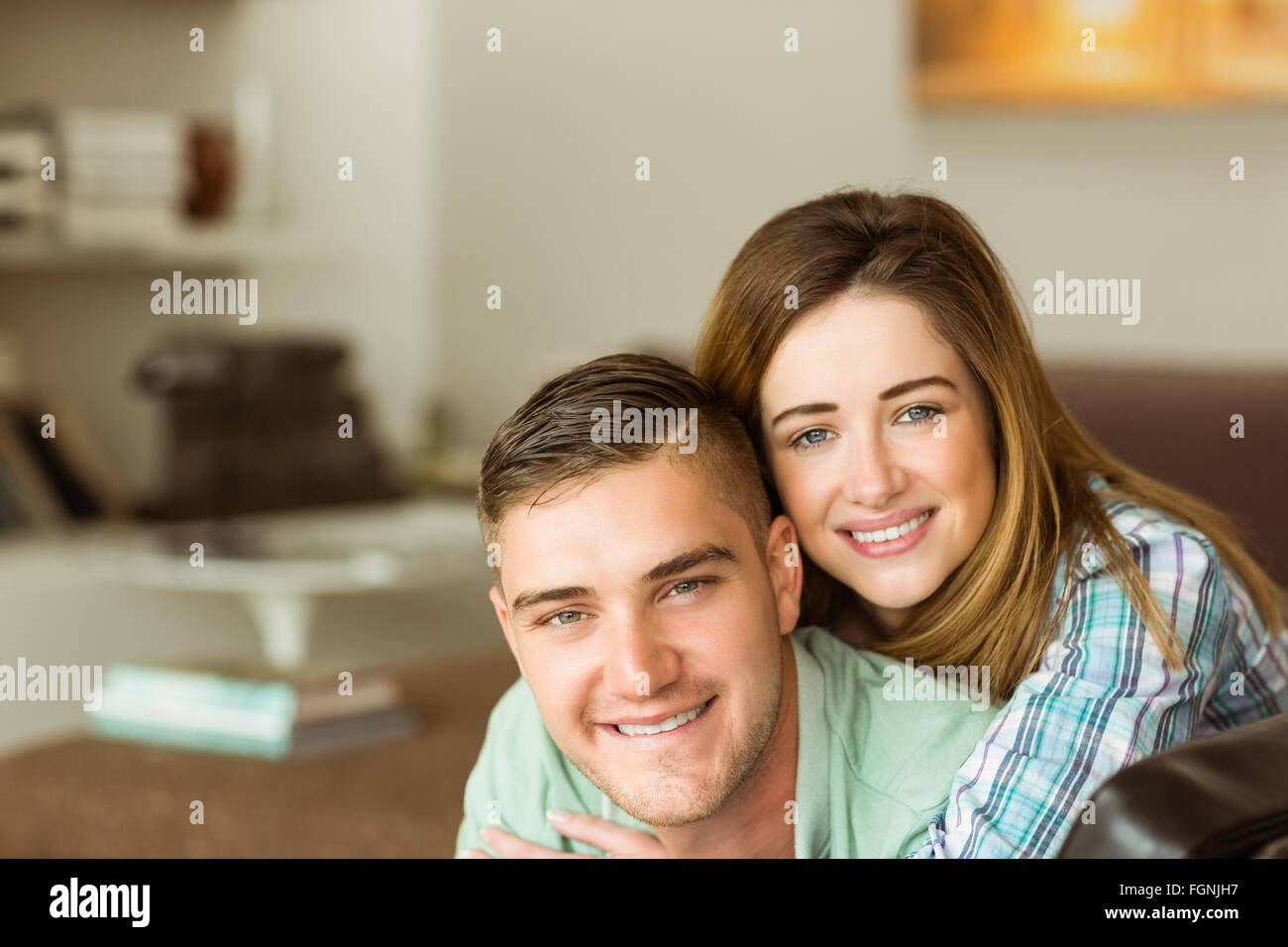 Cute couple relaxing on couch Stock Photo - Alamy
