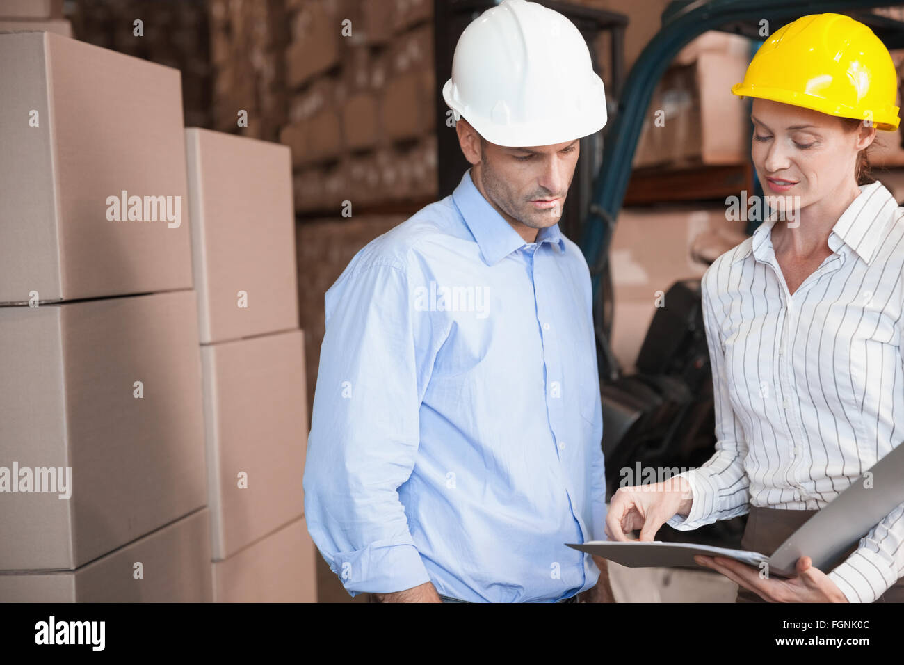 Warehouse team working together Stock Photo - Alamy