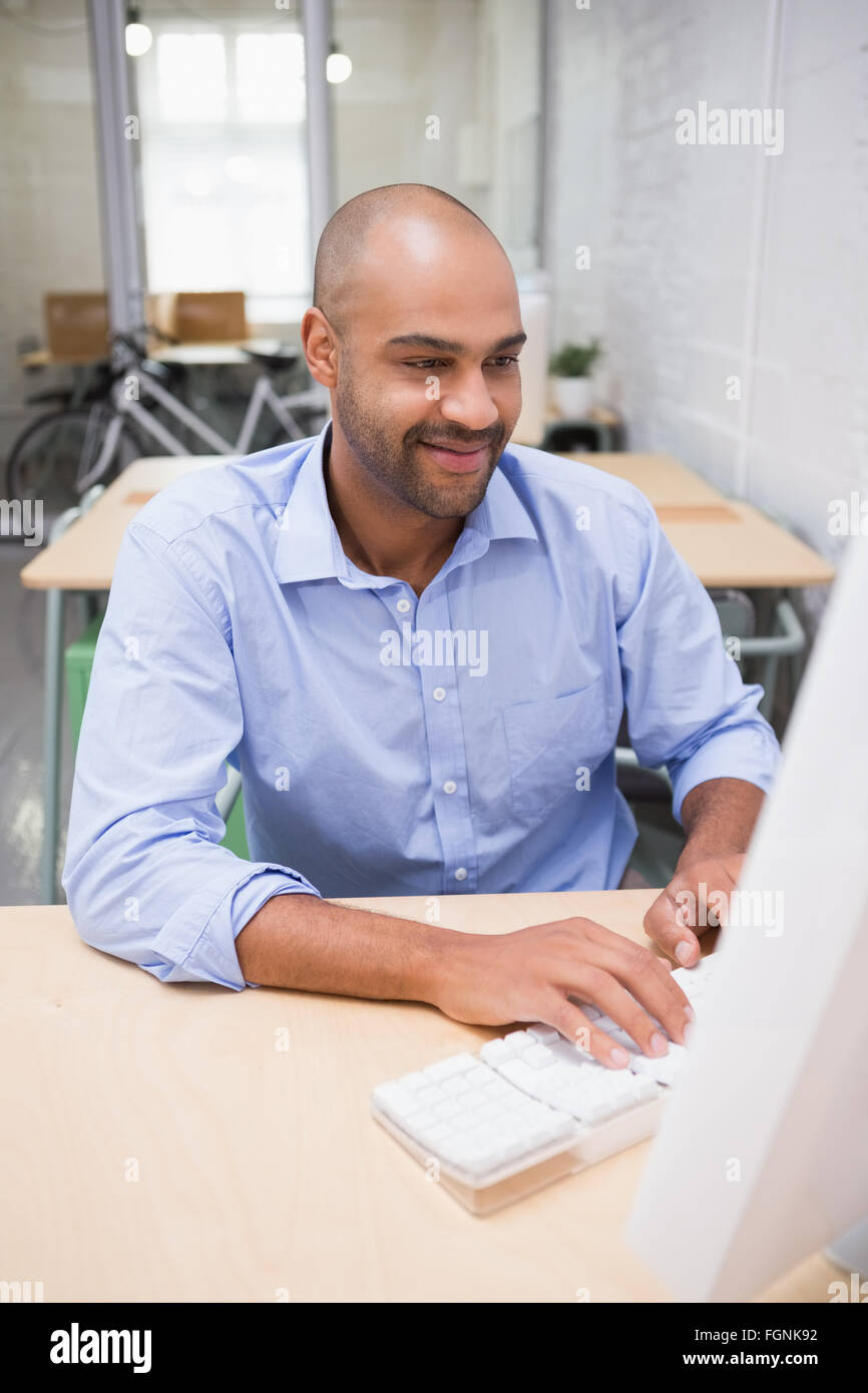 Mixed race businessman typing hi-res stock photography and images - Alamy
