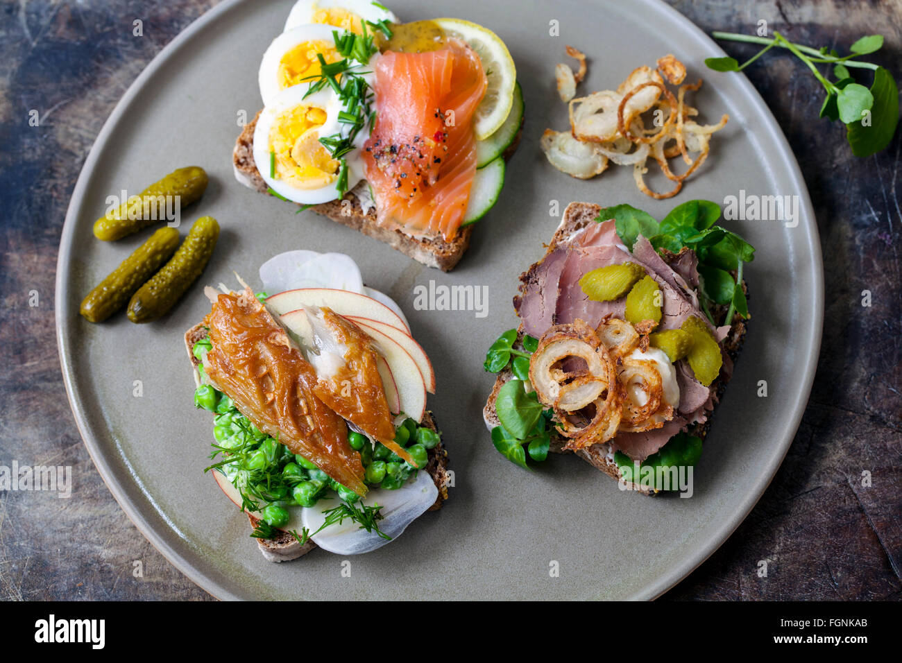 Scandinavian open sandwiches with smoked mackerel, salmon and egg and ...