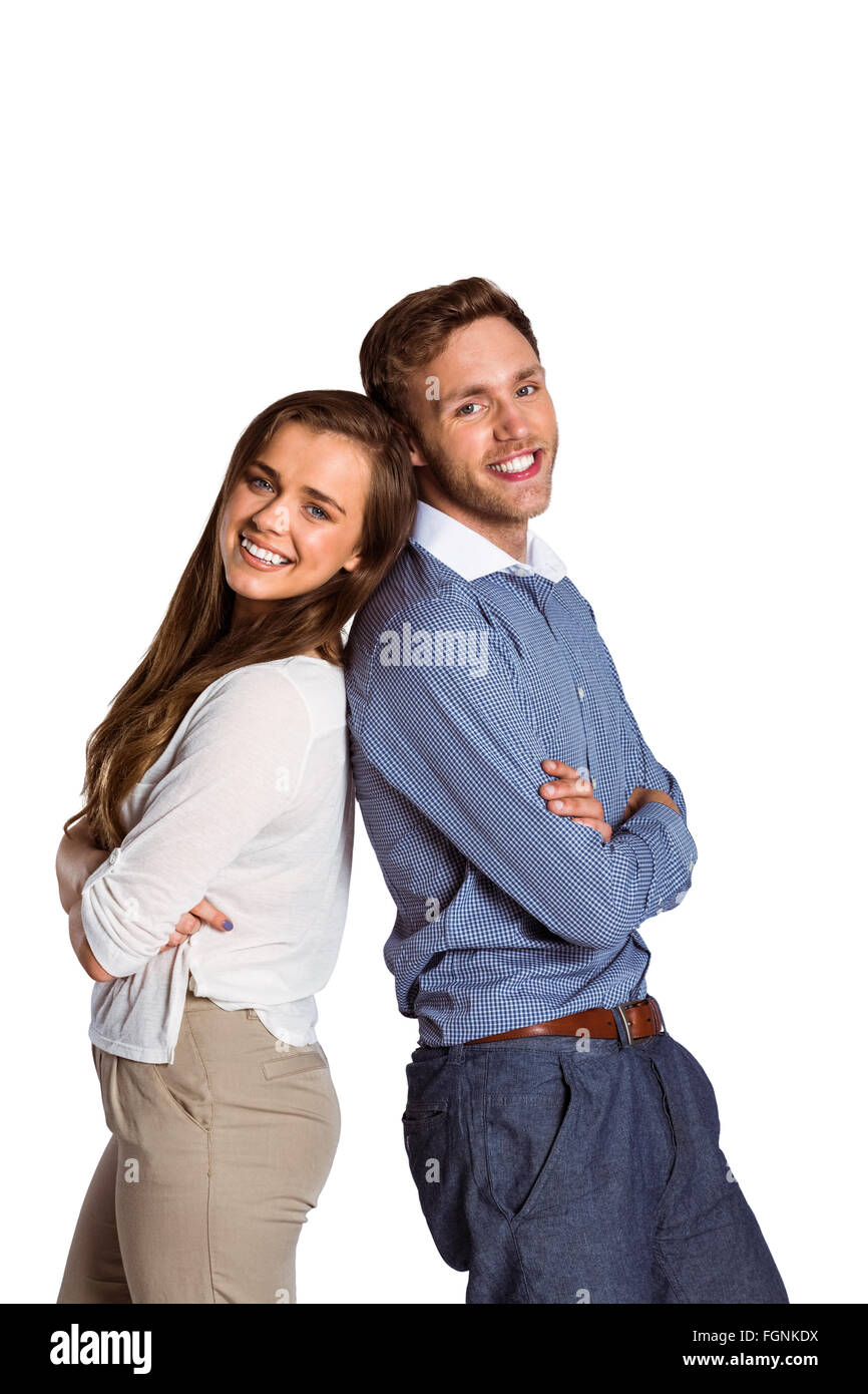 Portrait of happy couple back to back Stock Photo - Alamy