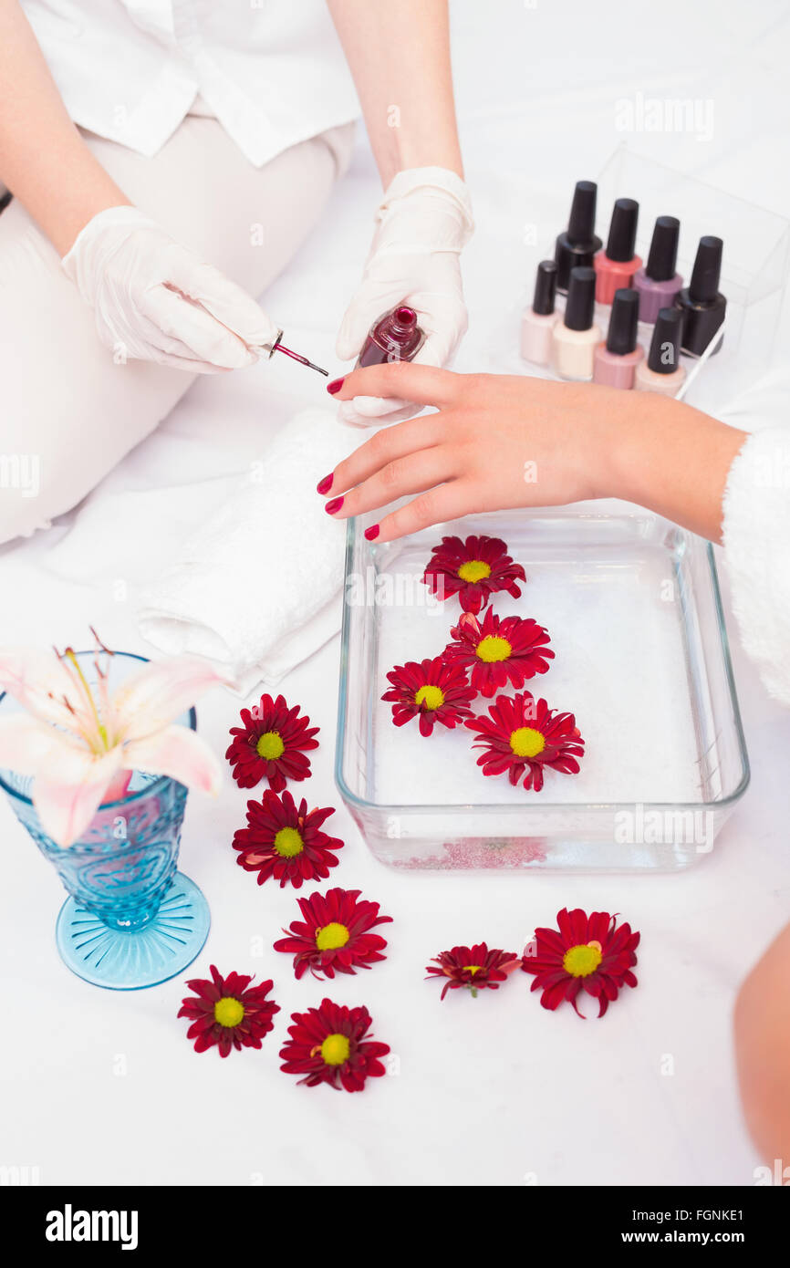 Woman getting her nails painted Stock Photo - Alamy