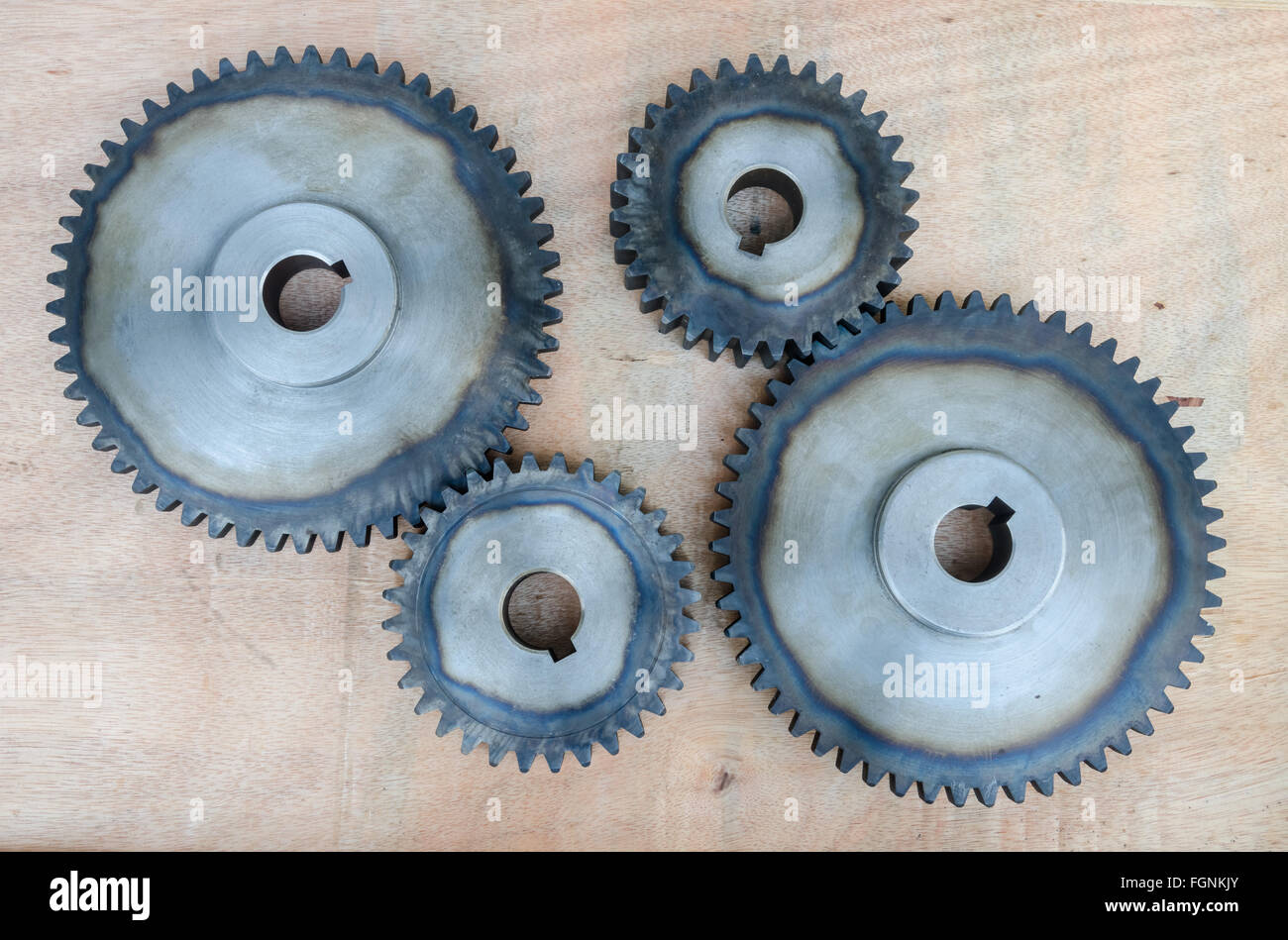 Huge set of rusty metal gears on wood background Stock Photo - Alamy