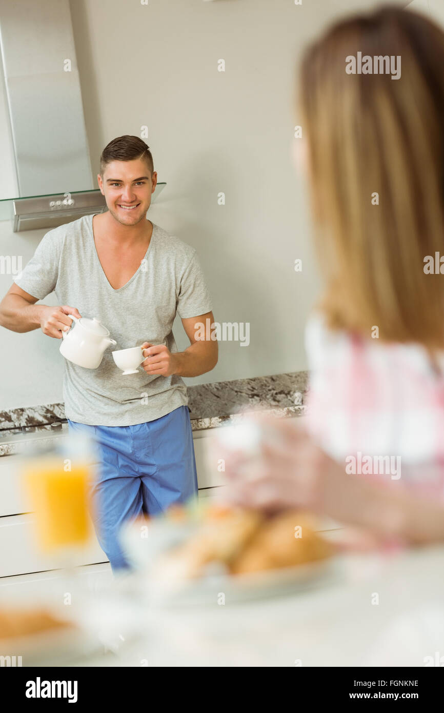 Cute couple having breakfast together Stock Photo - Alamy