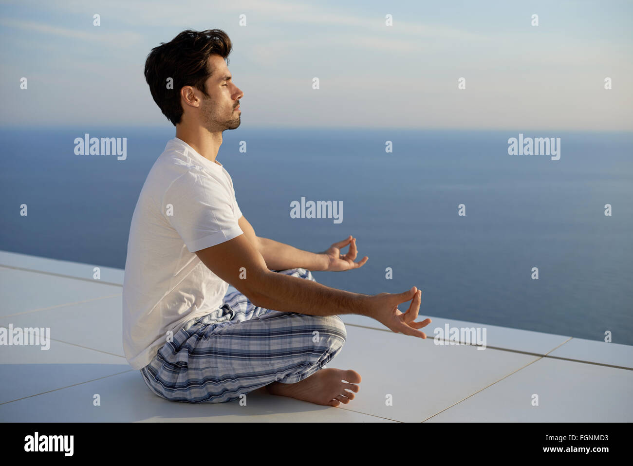 young man practicing yoga Stock Photo - Alamy