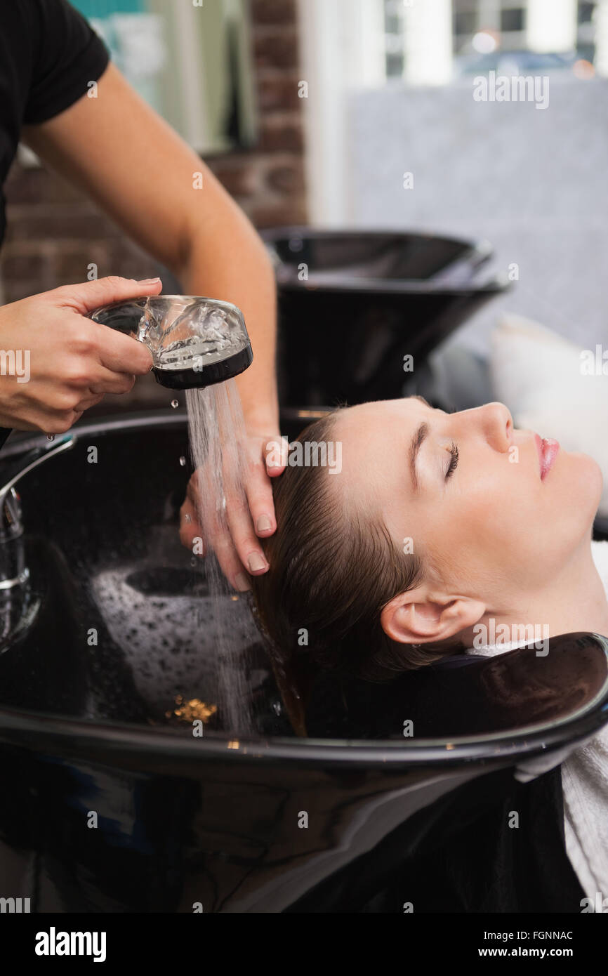 Customer getting their hair washed Stock Photo - Alamy