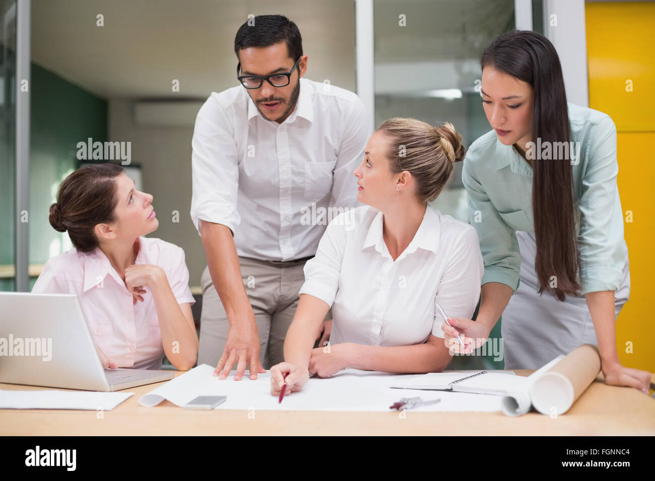 Architecture team working together at desk Stock Photo - Alamy
