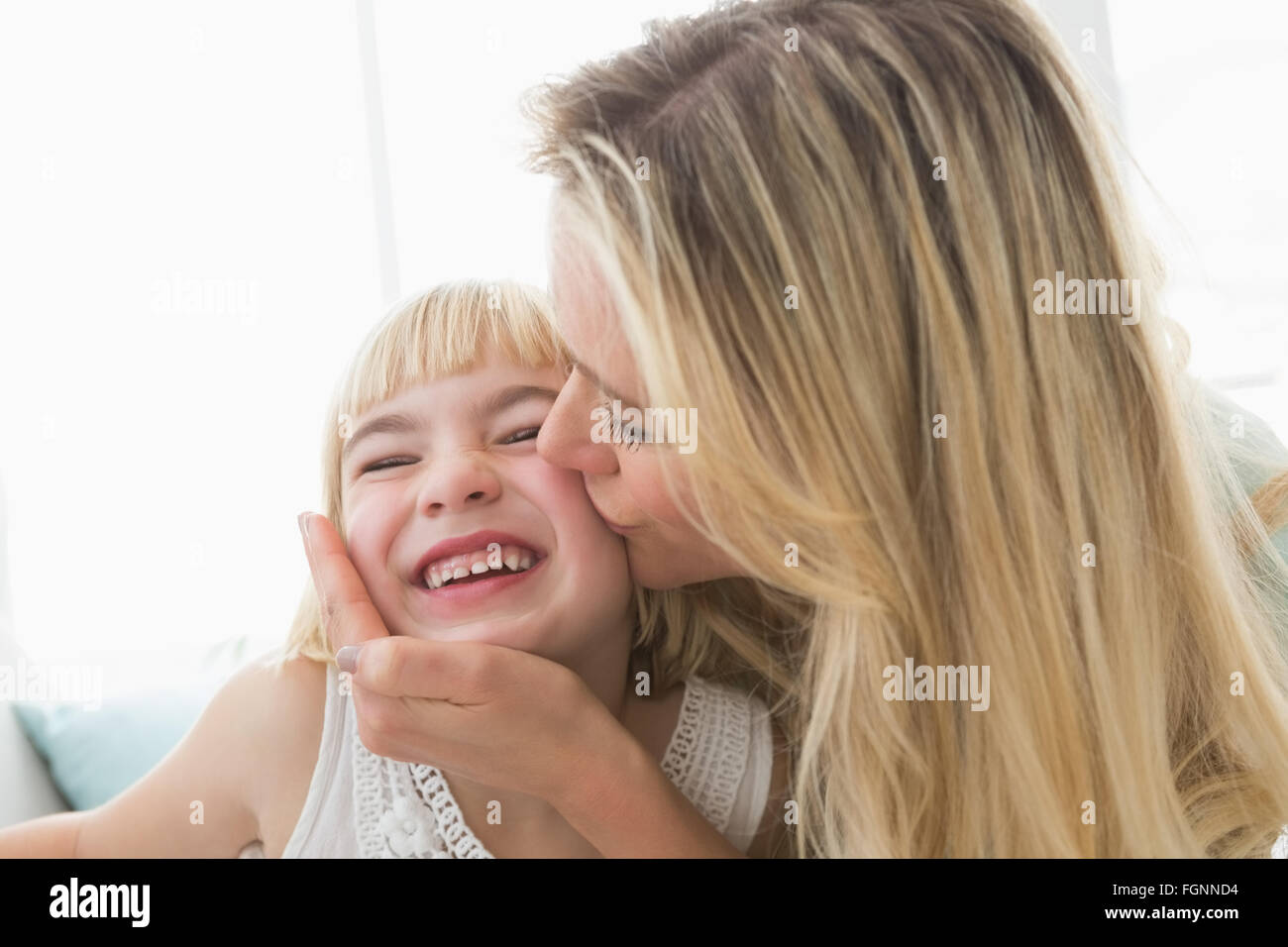 Girl kissing her mother on cheek hi-res stock photography and images ...