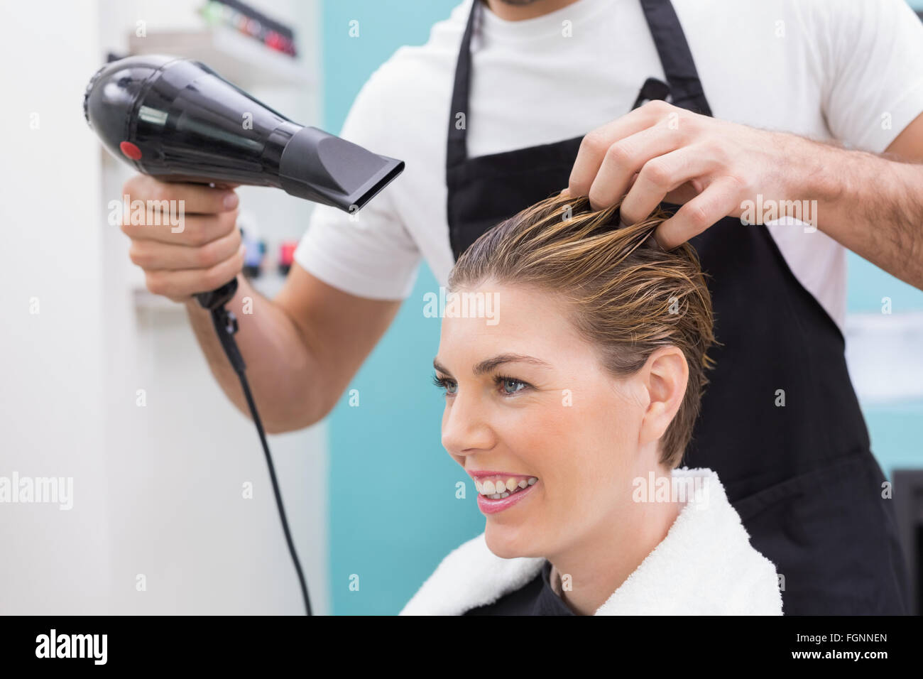 Woman getting her hair dried Stock Photo - Alamy
