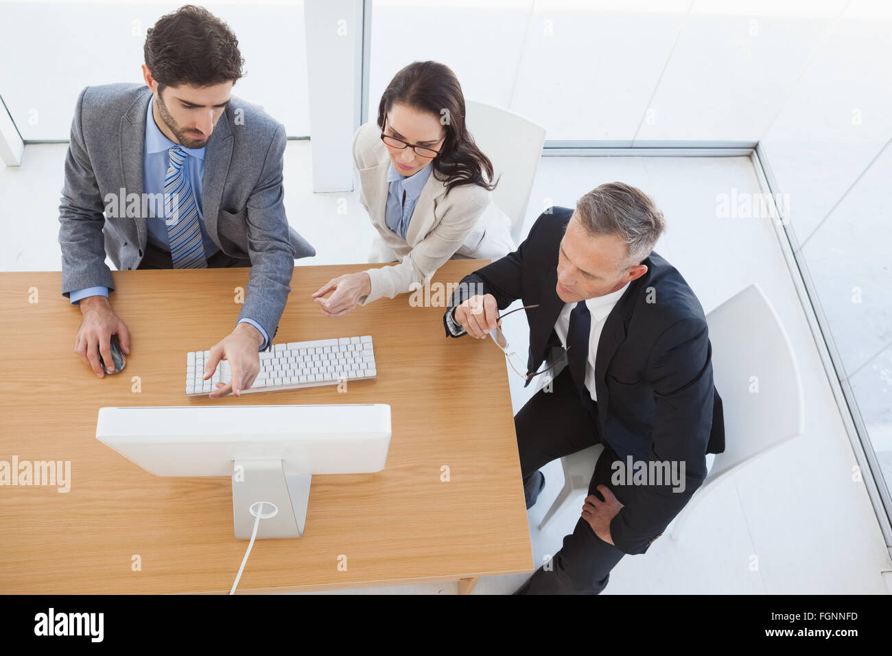 Business team watching a computer screen Stock Photo - Alamy
