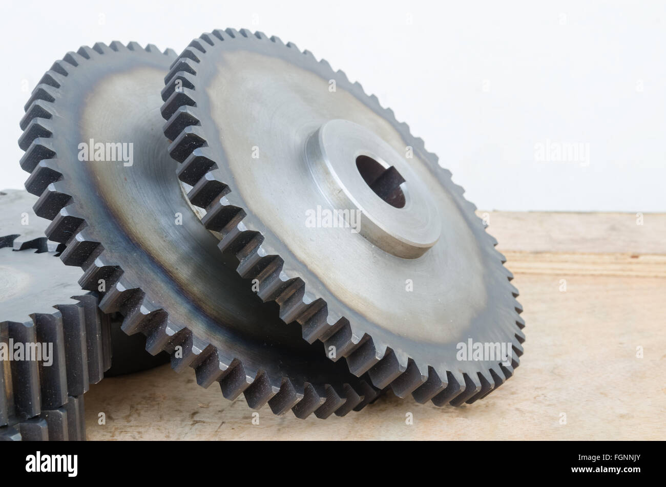 Huge set of rusty metal gears on wood box Stock Photo - Alamy