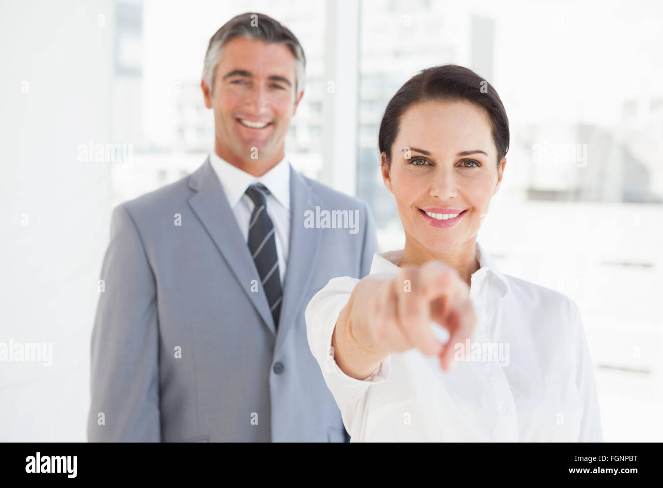 Smiling business people at work Stock Photo - Alamy