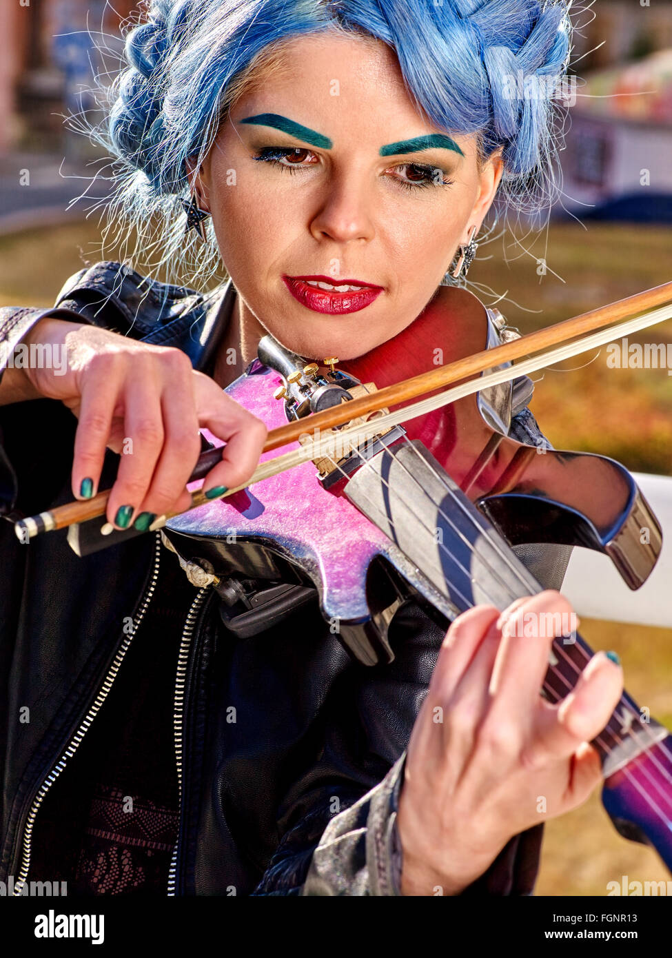 Music street performers with girl violinist Stock Photo - Alamy