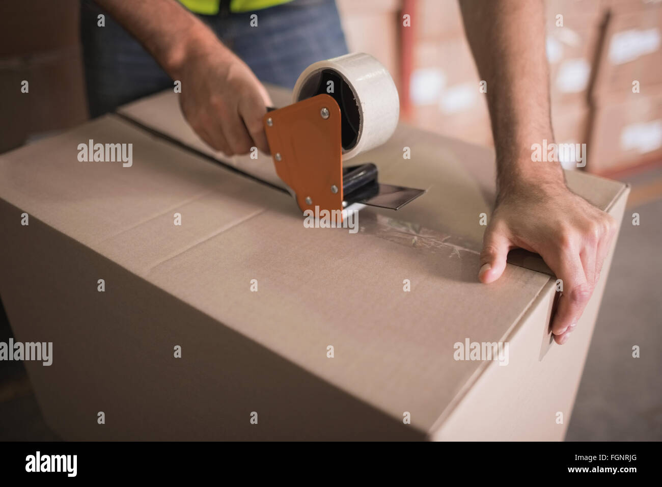 Worker preparing goods for dispatch Stock Photo - Alamy