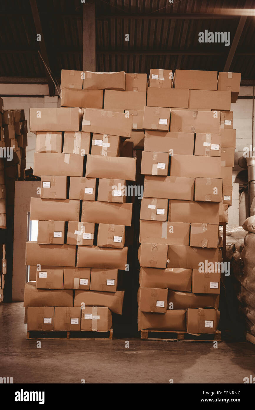 Cardboard boxes in warehouse Stock Photo - Alamy