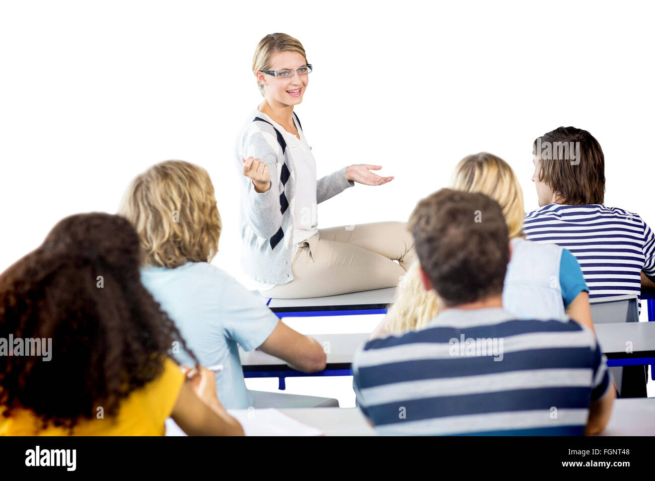 Teacher teaching students in class Stock Photo - Alamy
