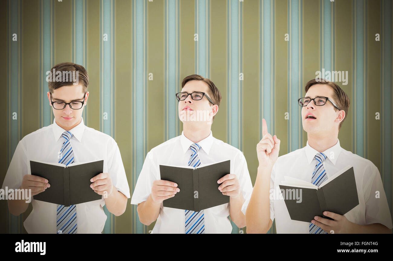 Composite image of nerd reading book Stock Photo - Alamy