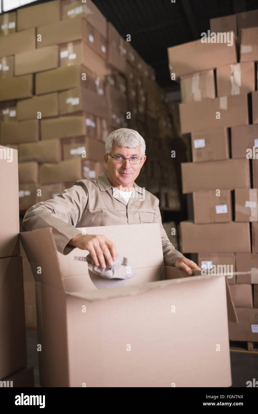 Man working in warehouse Stock Photo - Alamy