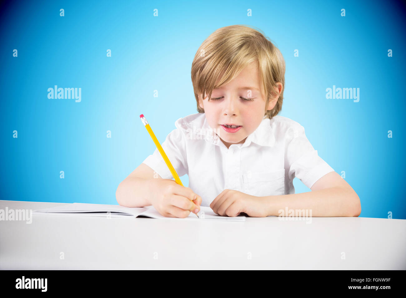 Composite image of cute pupil writing Stock Photo - Alamy