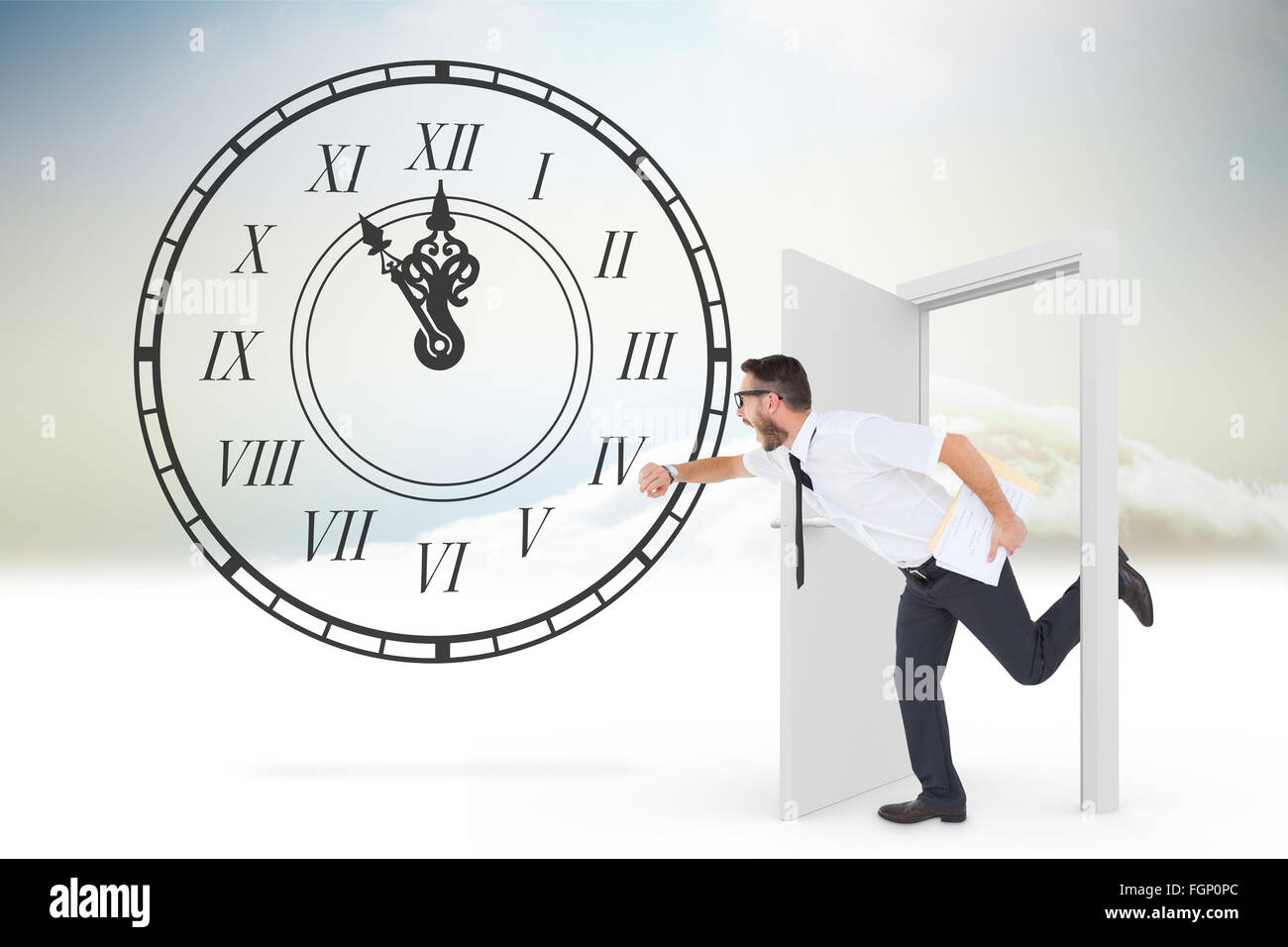 Composite image of geeky young businessman running late Stock Photo - Alamy