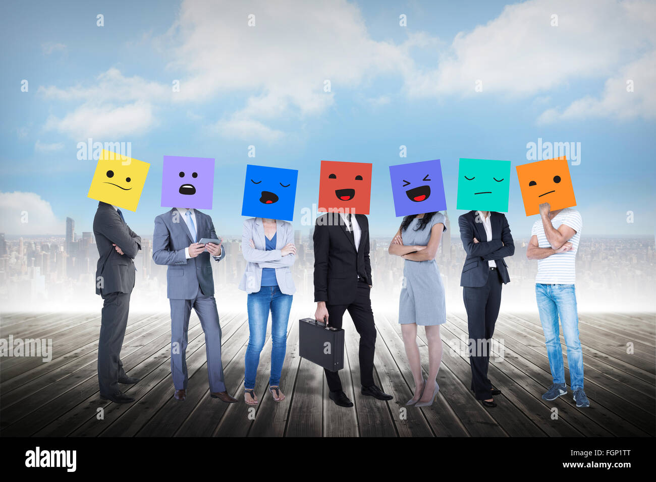 Composite image of people with boxes on their heads Stock Photo - Alamy