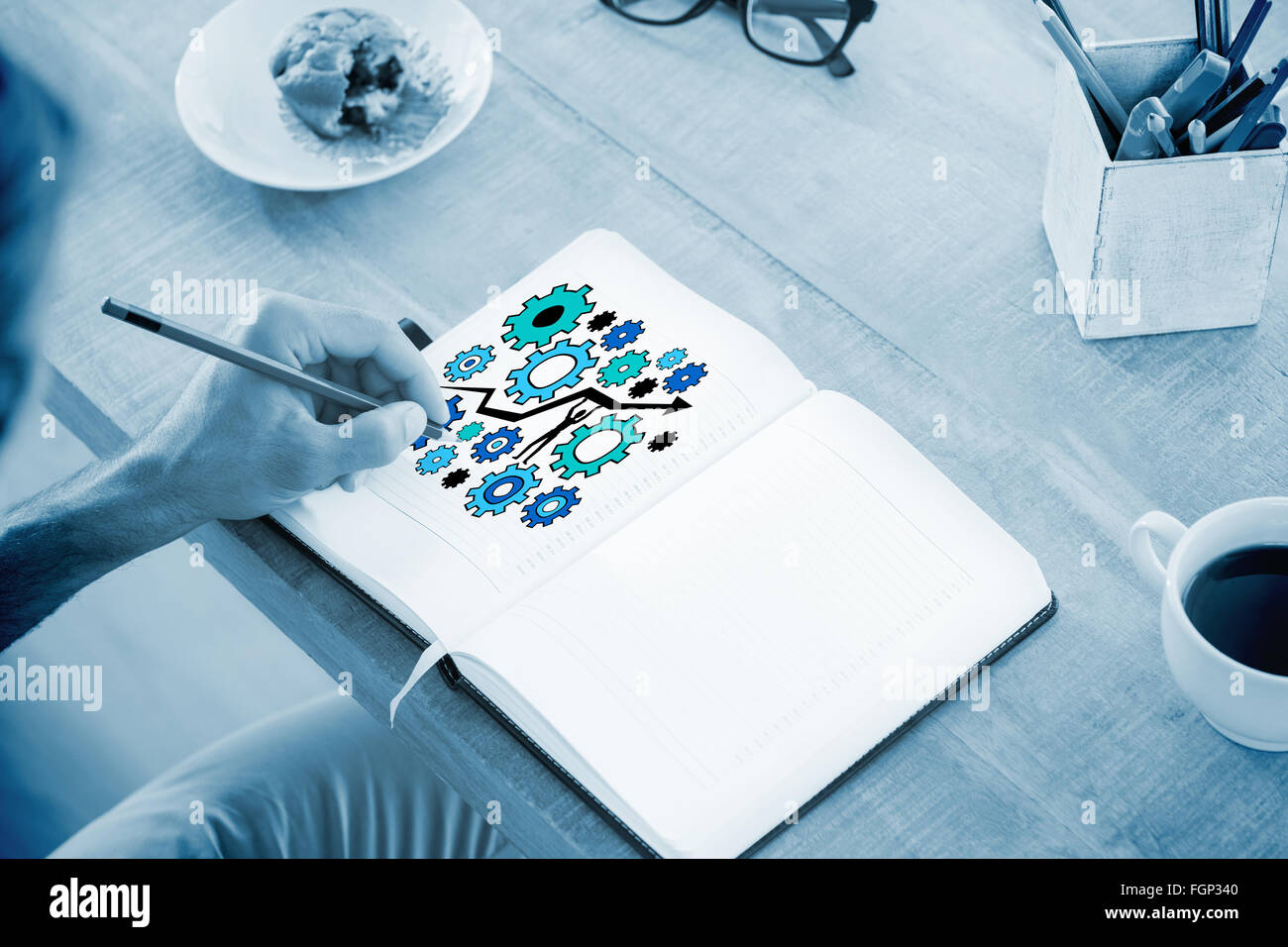 Composite image of man writing notes on diary Stock Photo - Alamy