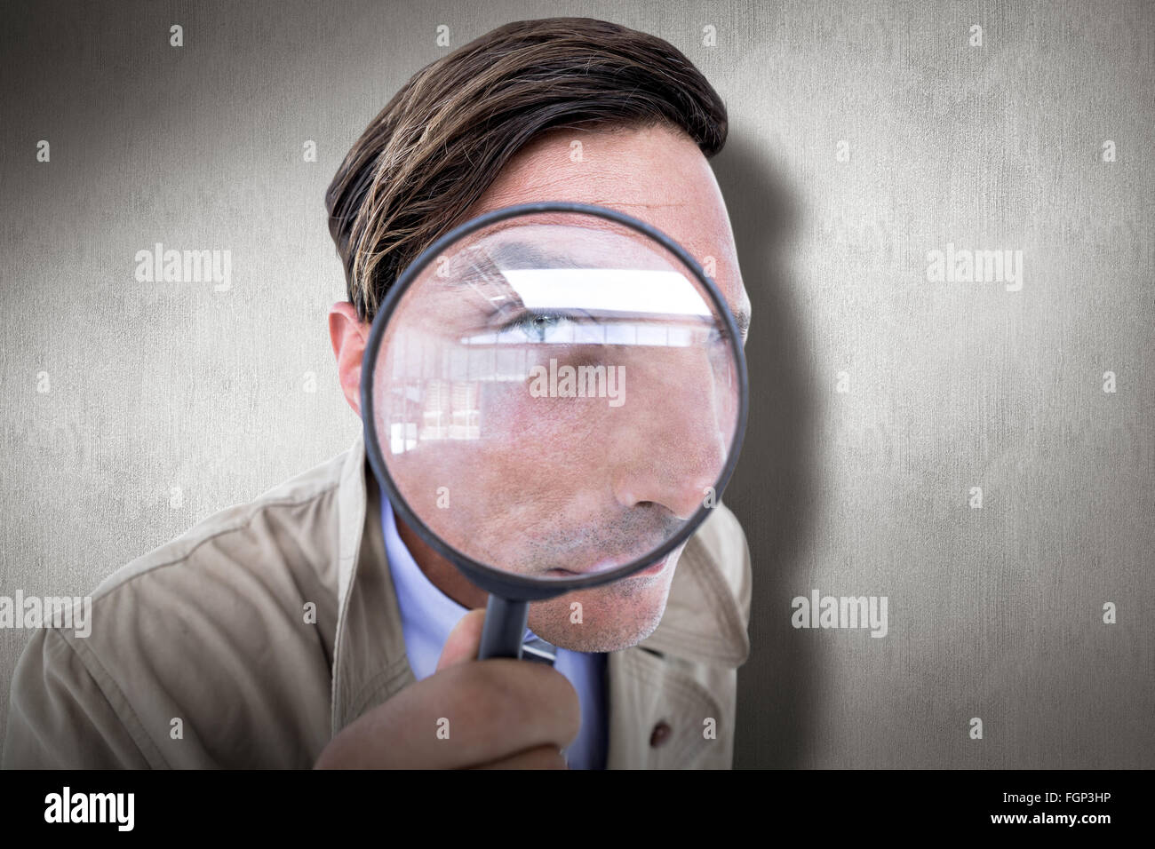 Composite image of spy looking through magnifier Stock Photo - Alamy