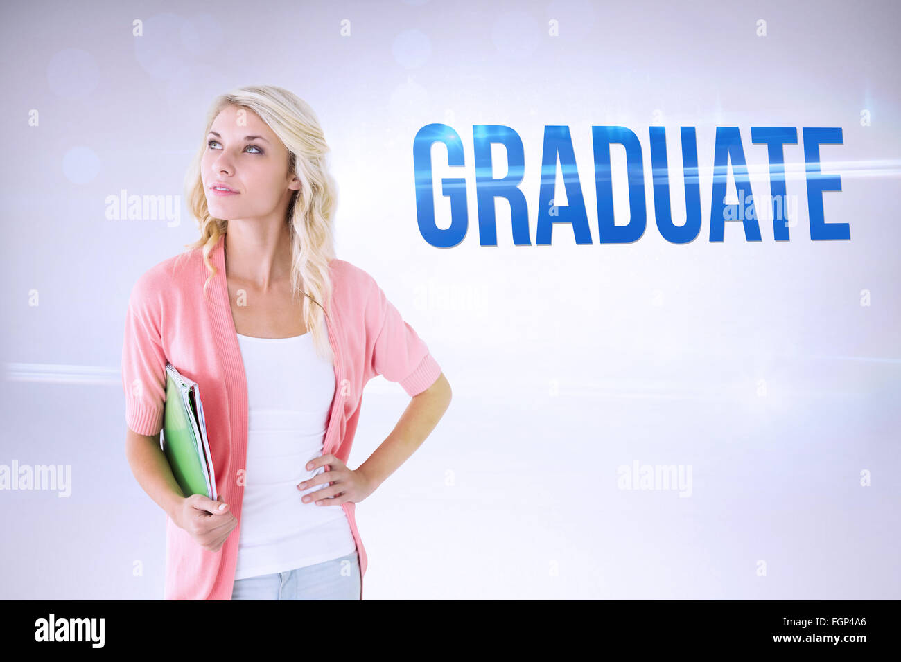 Graduate against grey background Stock Photo - Alamy